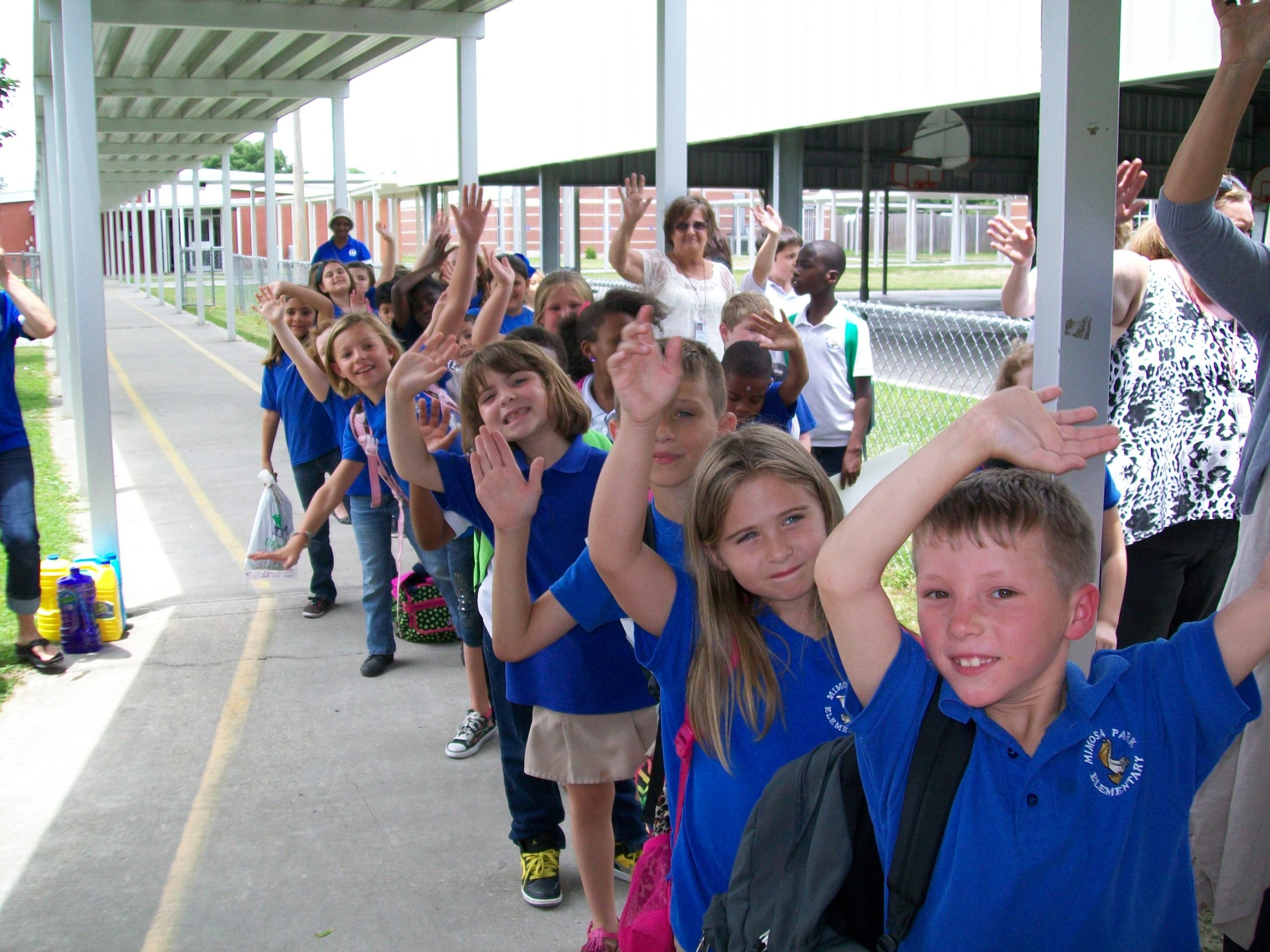 Students wave goodbye for the summer